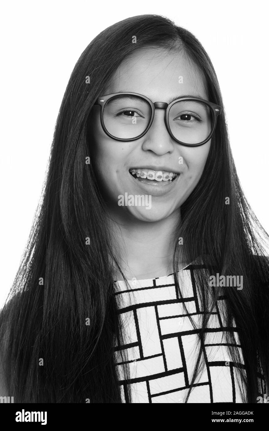 Face of young happy Asian teenage nerd girl smiling Stock Photo - Alamy
