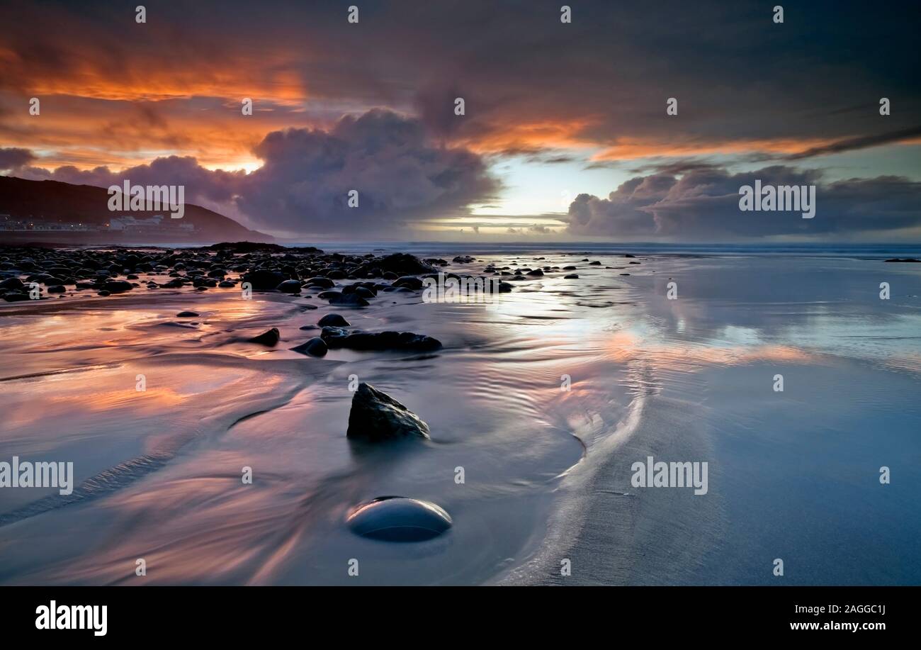 Sunset reflections on Westward Ho! Beach, North Devon, UK Stock Photo ...