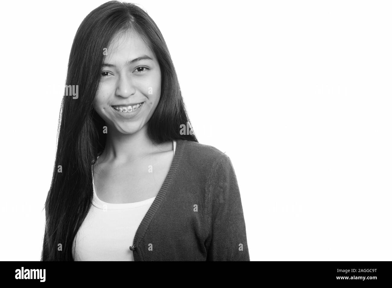 Studio shot of young happy Asian teenage girl smiling Stock Photo - Alamy