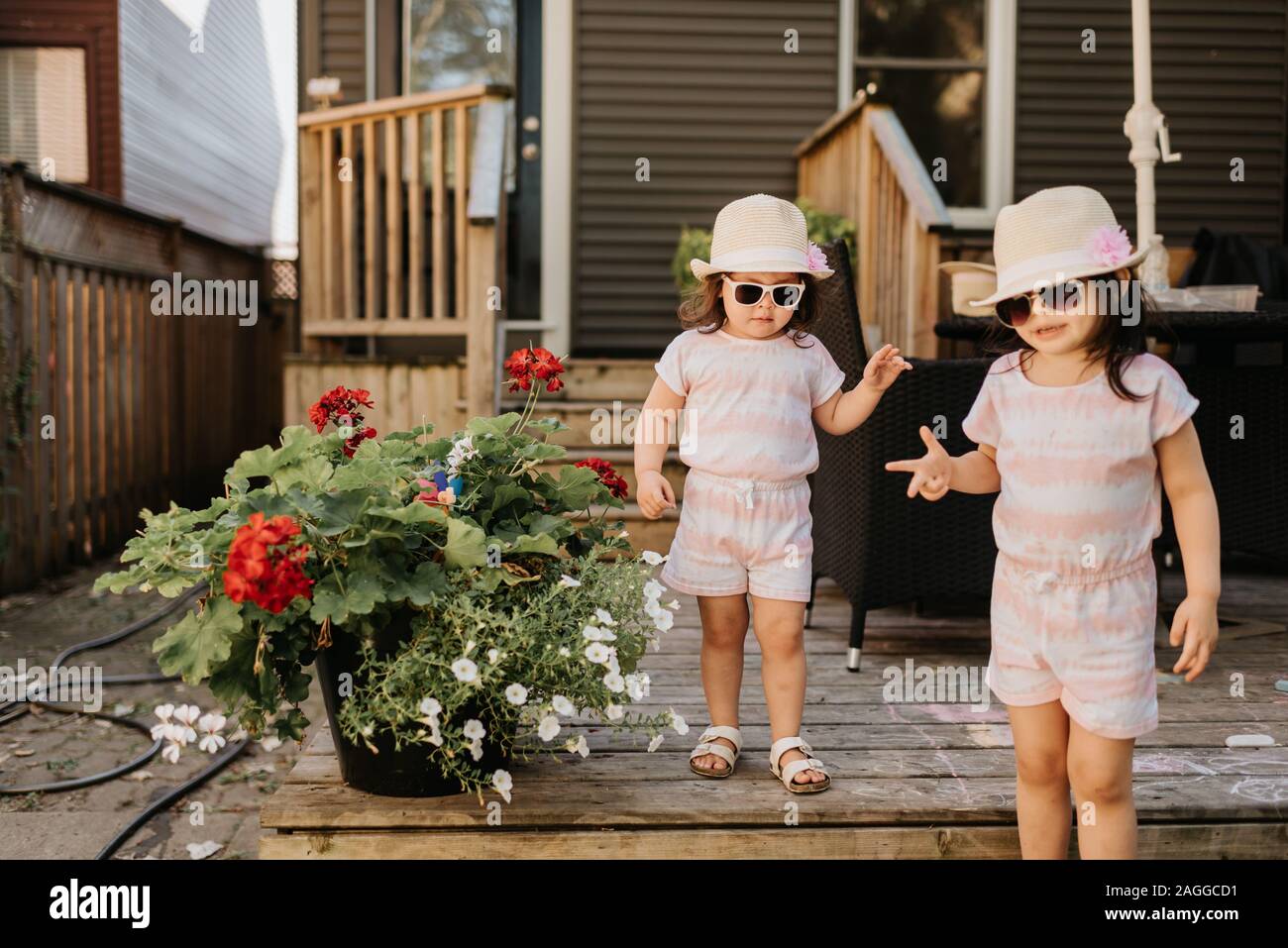 Two sisters standing back back hi-res stock photography and images - Alamy