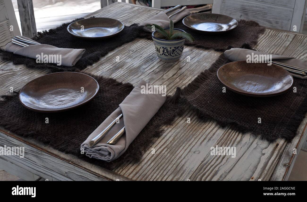 A Natural looking Table setting for Four People Stock Photo - Alamy