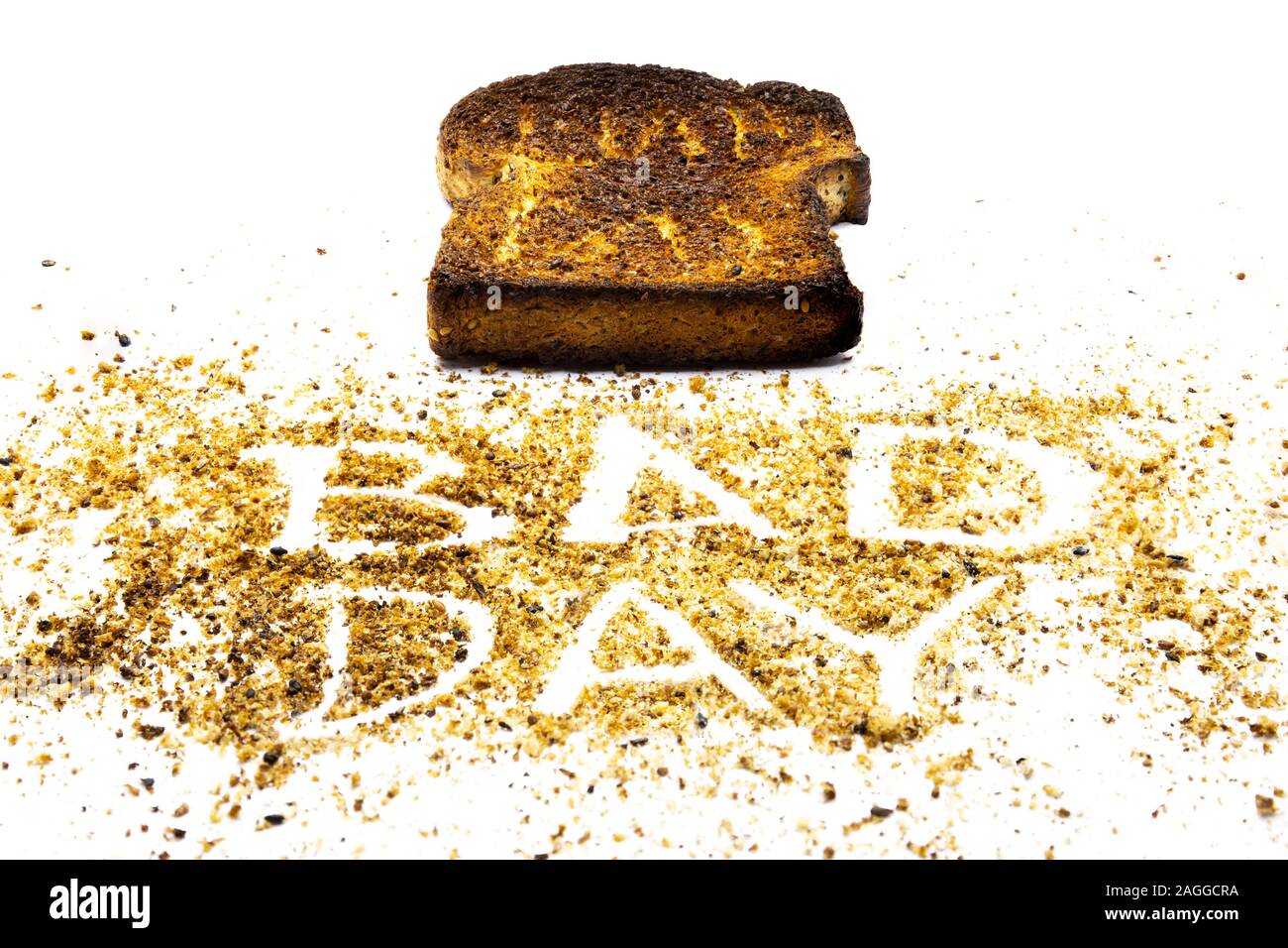 Toast burning with letter isolated on white background Stock Photo - Alamy