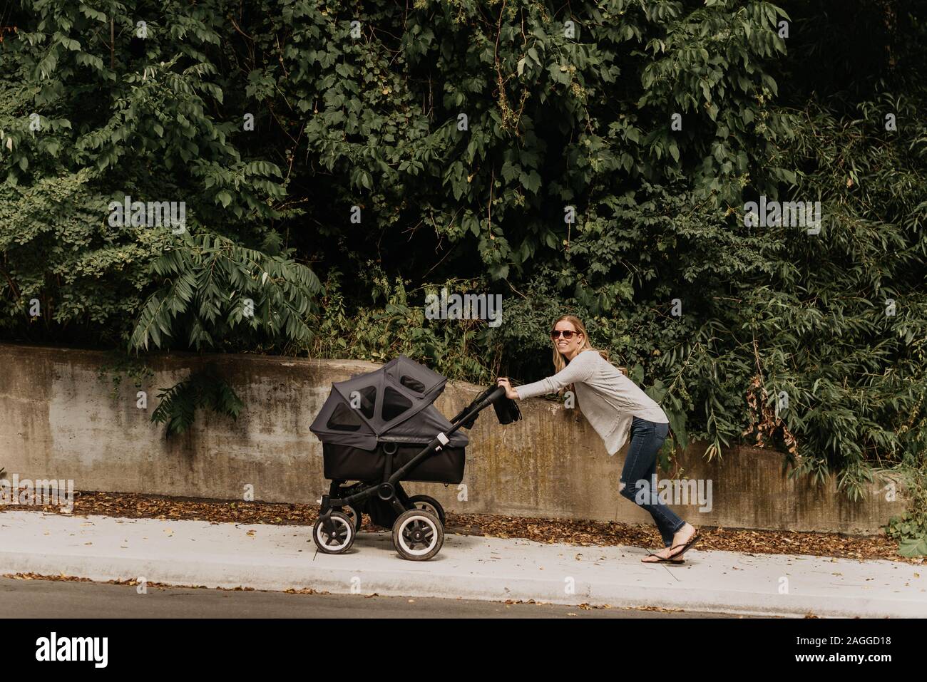 Pushing baby carriage hi-res stock photography and images - Alamy