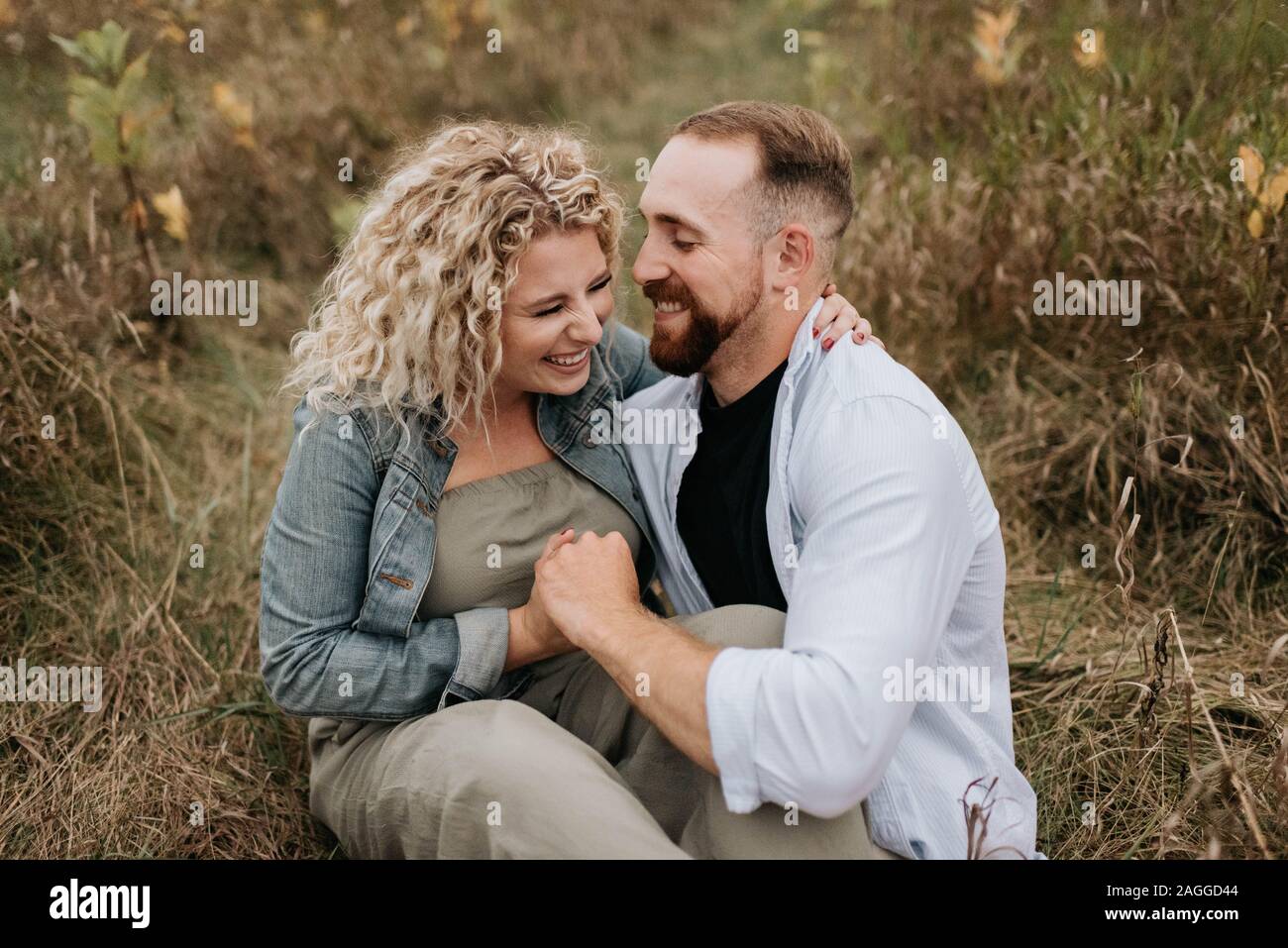Young couple hugging and talking in countryside Stock Photo - Alamy