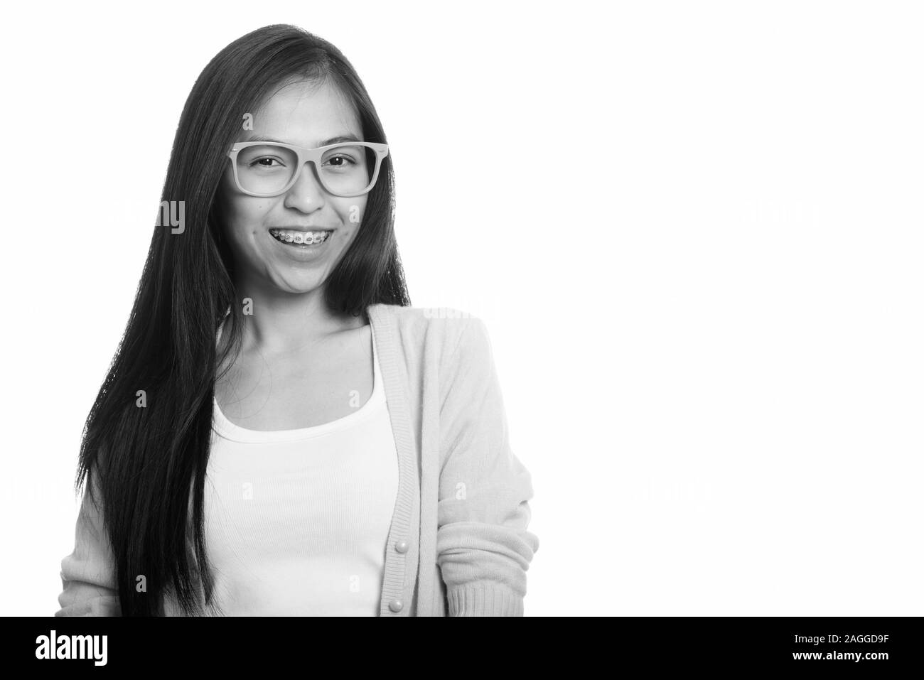 Studio shot of young happy Asian teenage girl smiling Stock Photo - Alamy