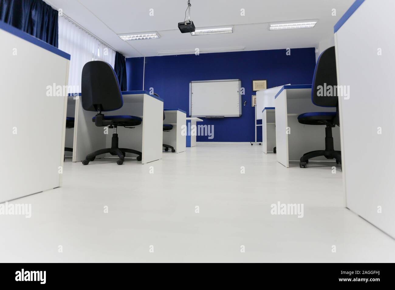 Economy school classroom with smart board and without students or ...