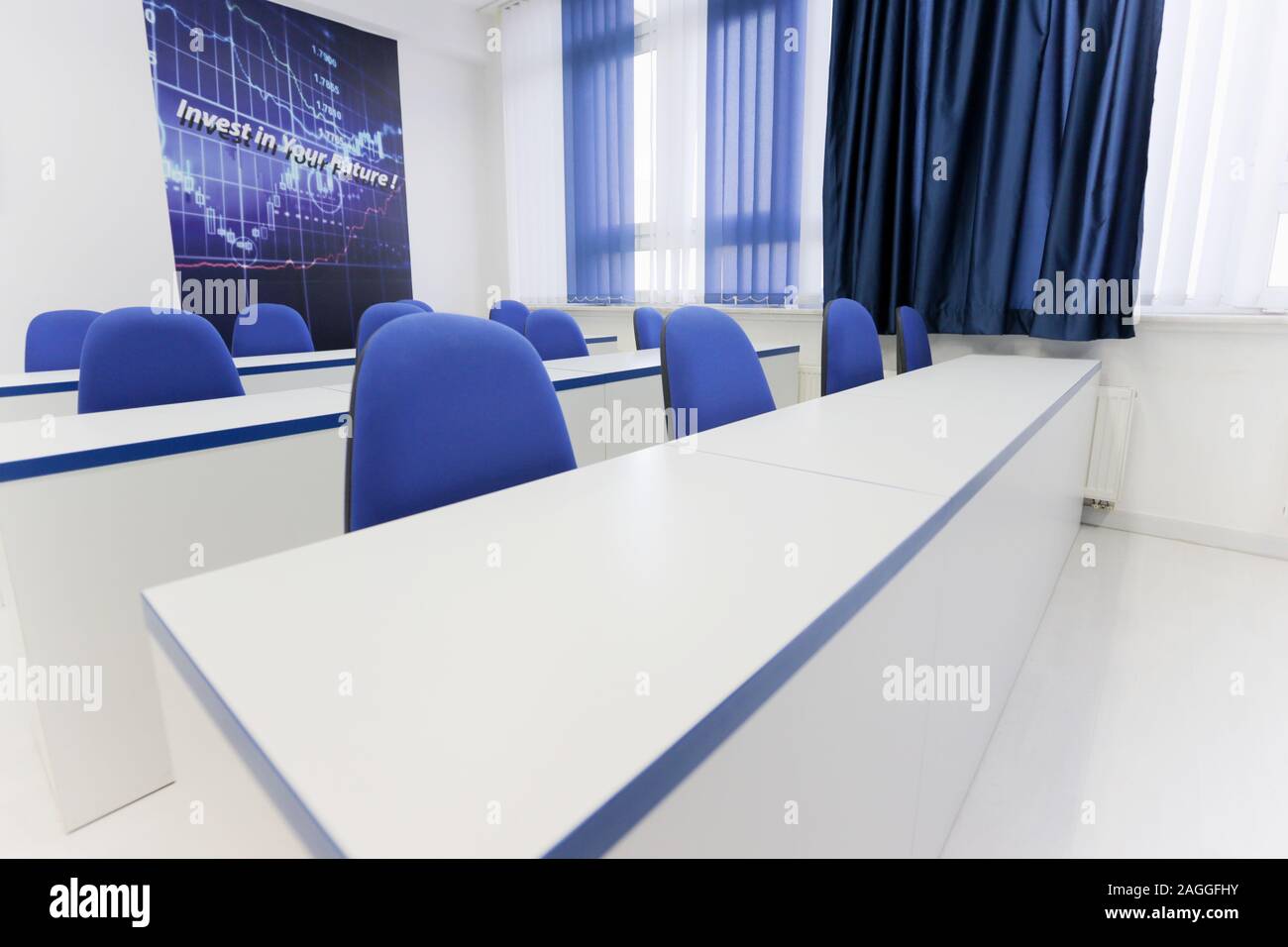 Economy school classroom without students or teachers with chairs and ...