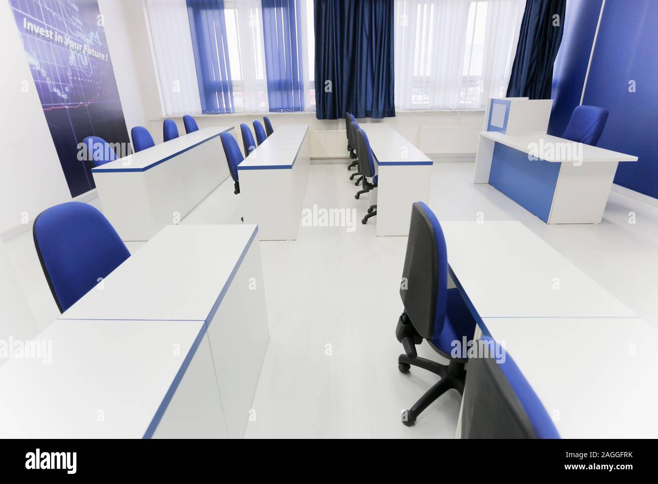 Economy school classroom without students or teachers with chairs and ...