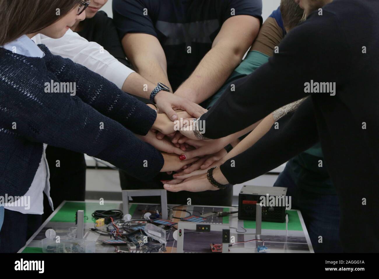 Group of young students in technical vocational training celebrating ...