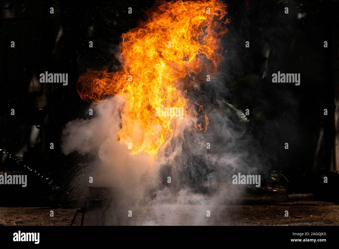 Flames caused by the explosion of the oil. Demonstration of water on ...