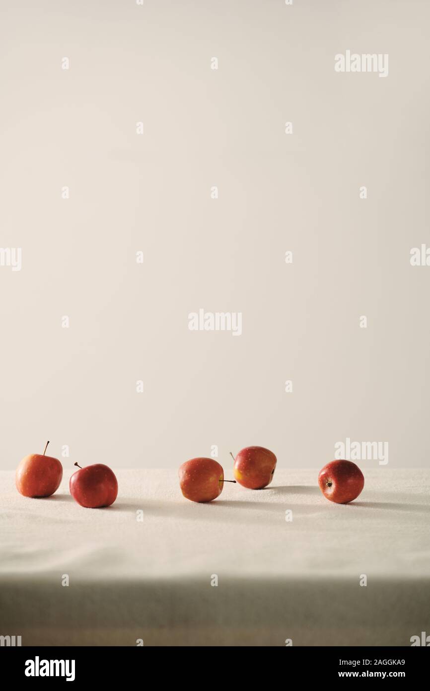 organic red apple lying on white linen tablecloth Stock Photo - Alamy