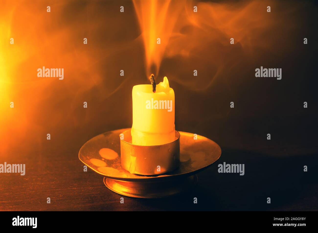 extinct candle on a wooden table at night Stock Photo - Alamy