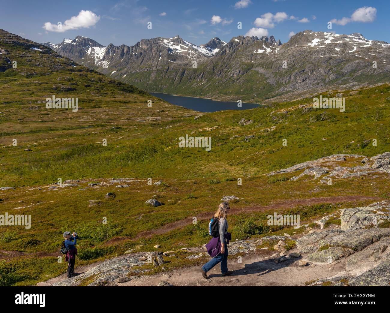KVALØYA ISLAND, TROMS COUNTY, NORWAY - Two women hiking in mountain ...