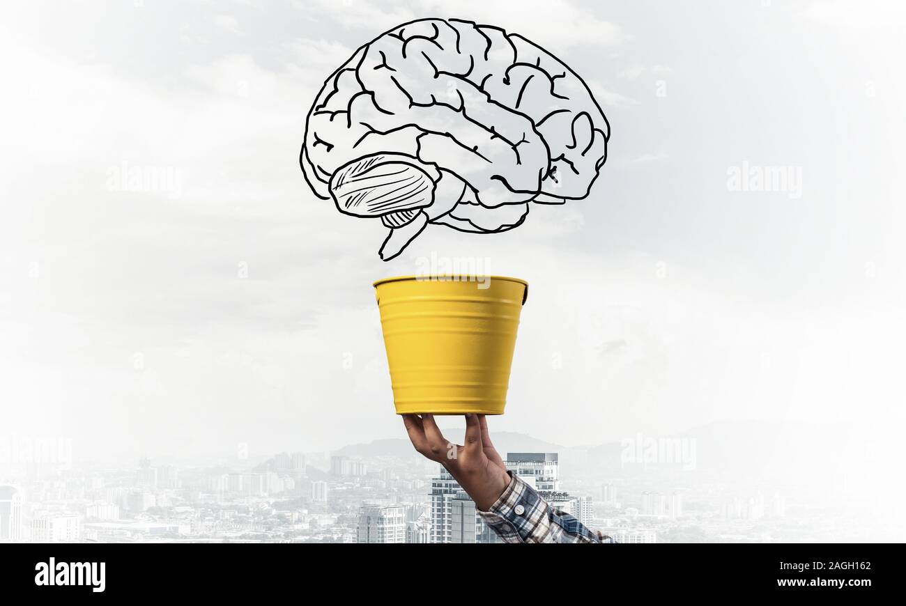 Brain drawing flying above yellow pot Stock Photo - Alamy