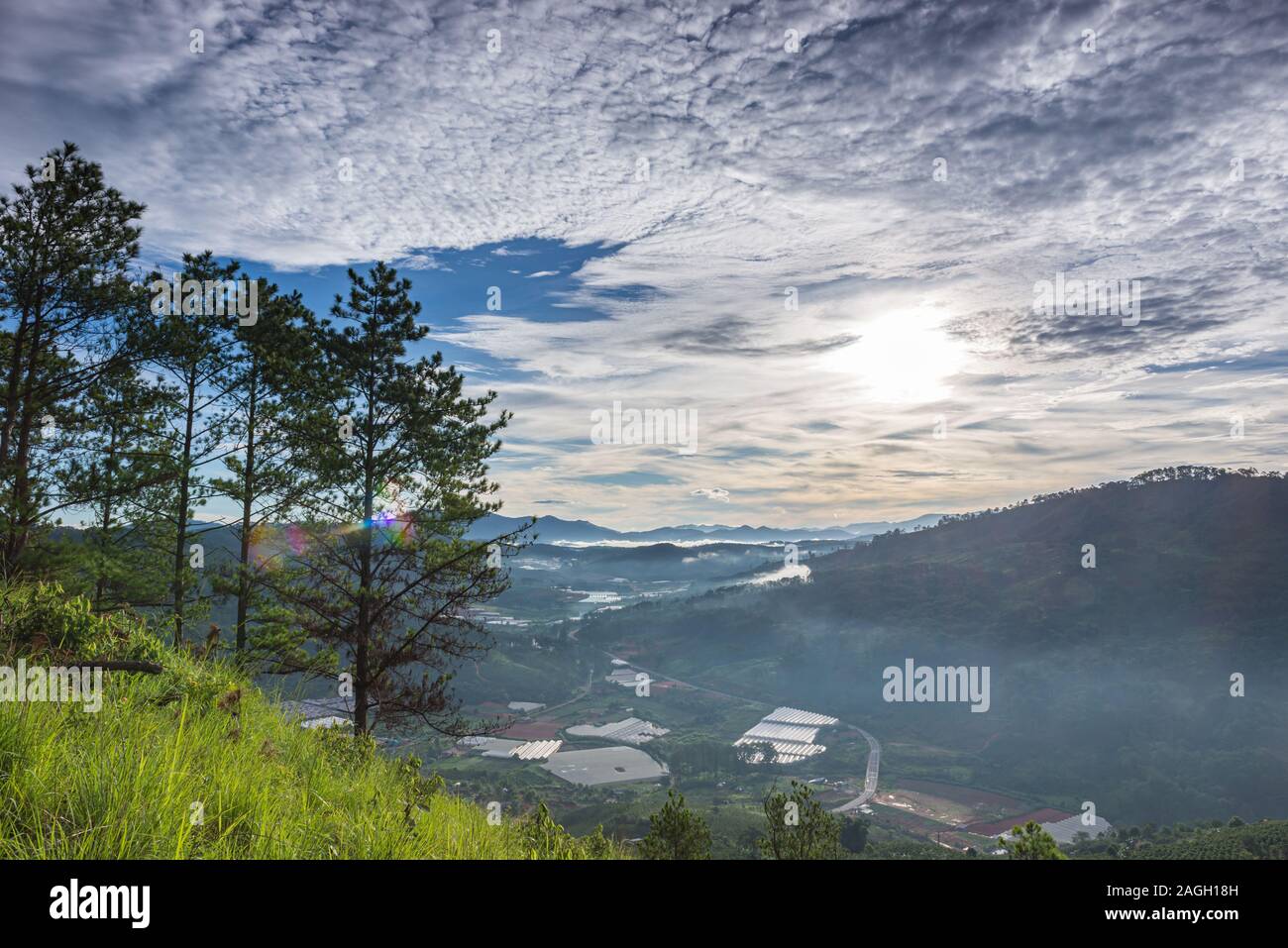 Overcast sky over the mountains and valley in early morning Stock Photo ...