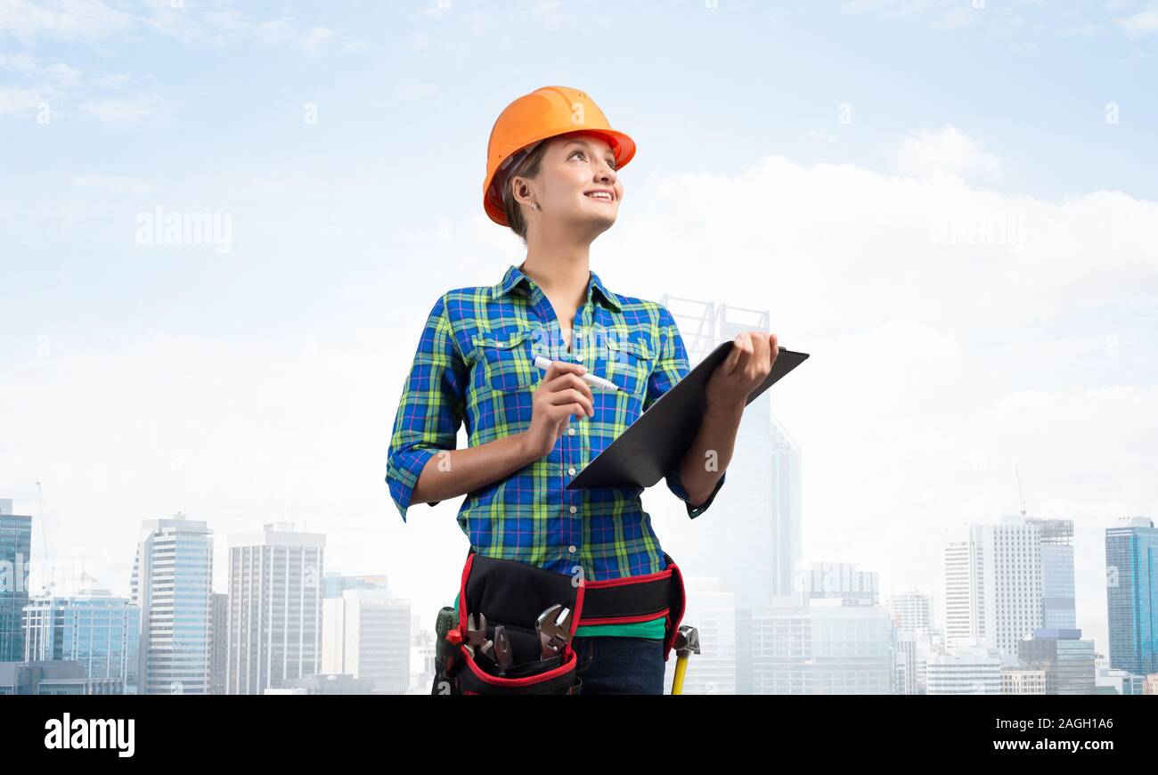 Young building inspector checking outdoor Stock Photo - Alamy