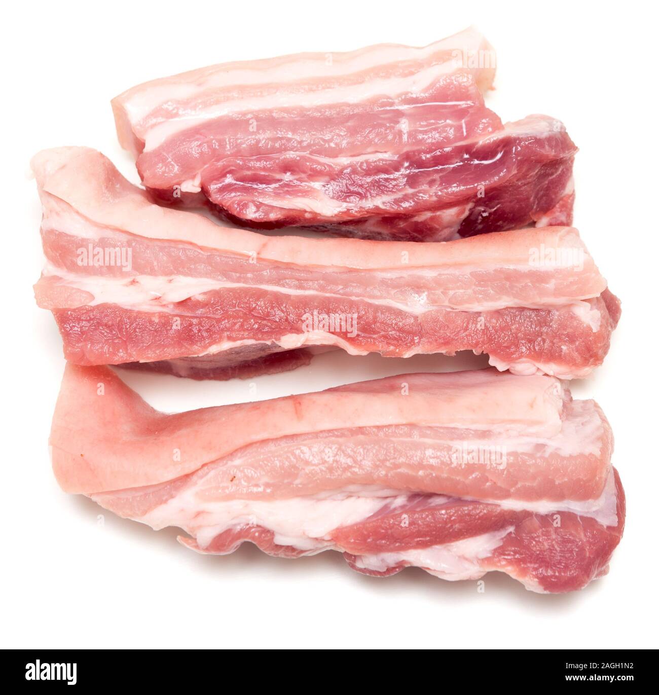 Pork belly meat isolated on white background Stock Photo - Alamy