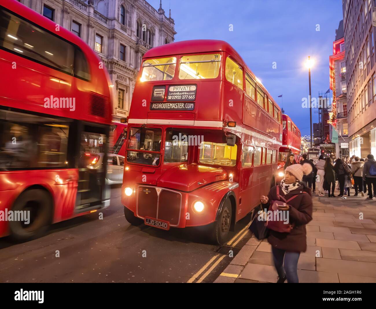 Two old type Routemaster London red buses and a modern Routemaster bus ...