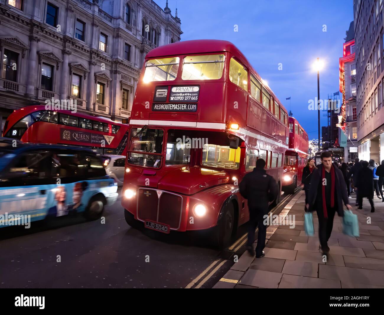 Two old type Routemaster London red buses and a modern Routemaster bus ...