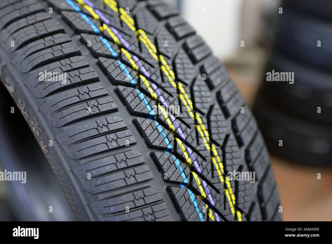 profile of a new car tyre in a car repair shop Stock Photo - Alamy