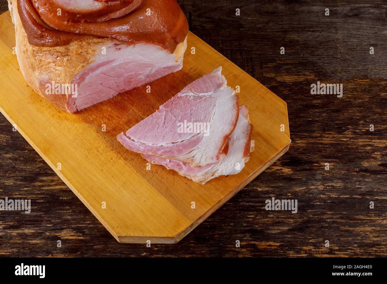 Sliced smoked shoulder ham pork on cutting board Stock Photo - Alamy