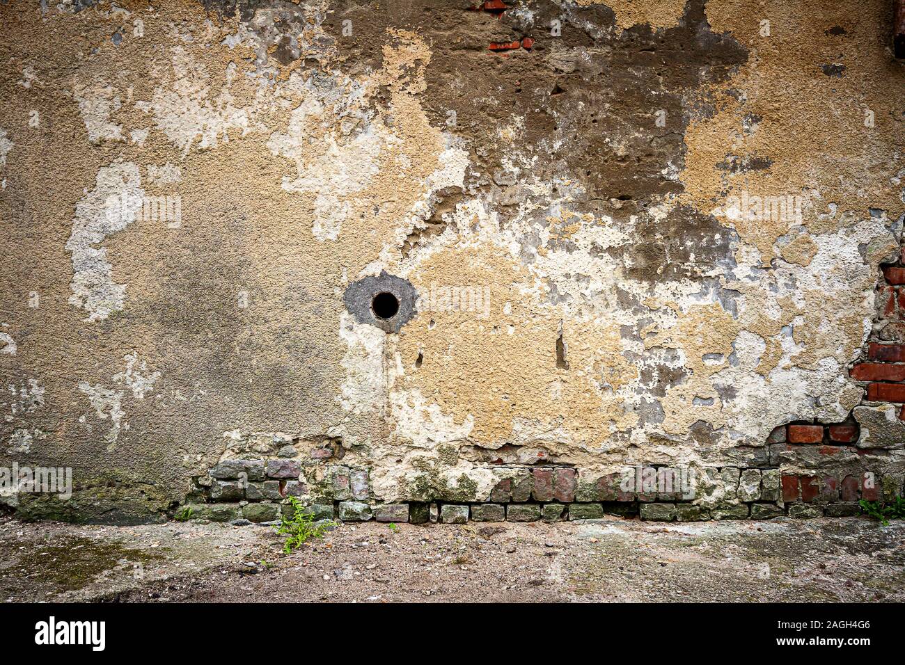 Old weathered wall of bricks and a ground Stock Photo - Alamy