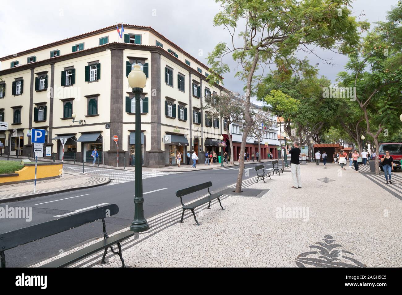 People walking on Avenida Arriaga boulevard in downtown Funchal ...