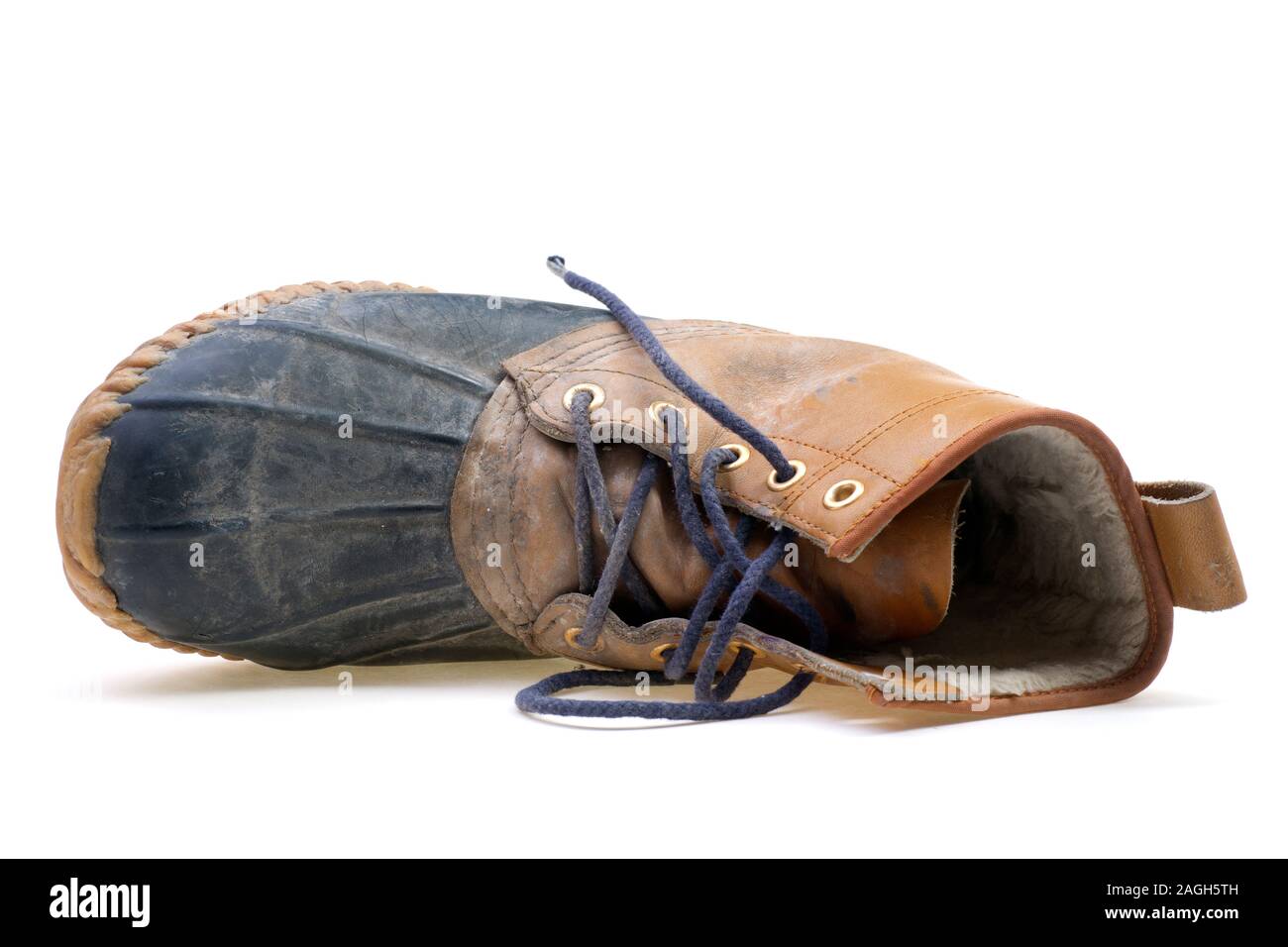 Photograph of single used rubber work boot, isolated on white Stock ...