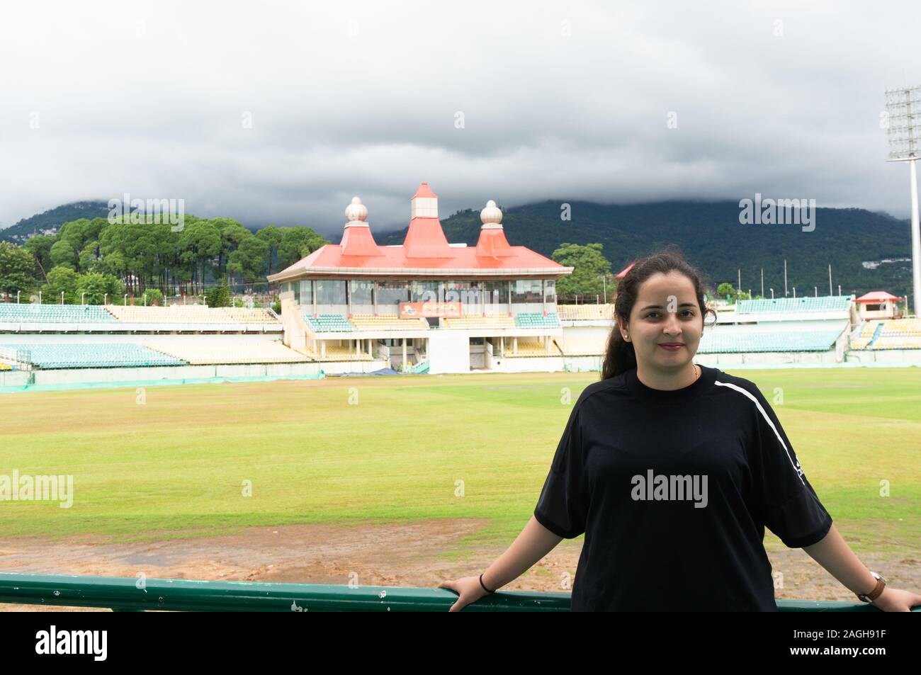 Young indian woman wearing black shirt standing at the iconic cricket ...