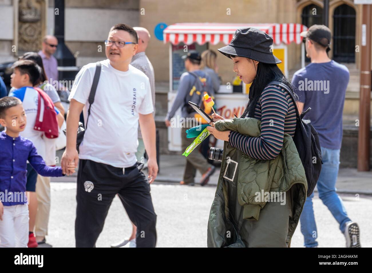 Cambridge, UK, August 1, 2019. Happy chinese tourists in cambridge ...