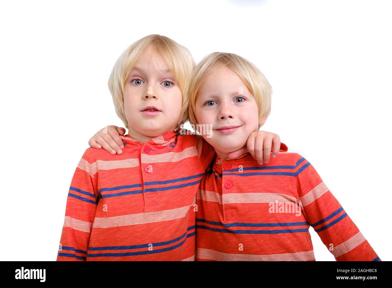 Two caucasian boys brothers posing in studio Stock Photo - Alamy