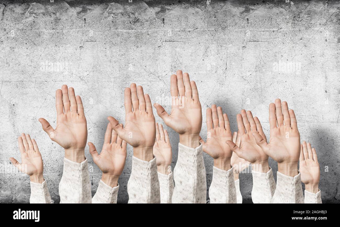Row of man hands showing voting gesture Stock Photo - Alamy