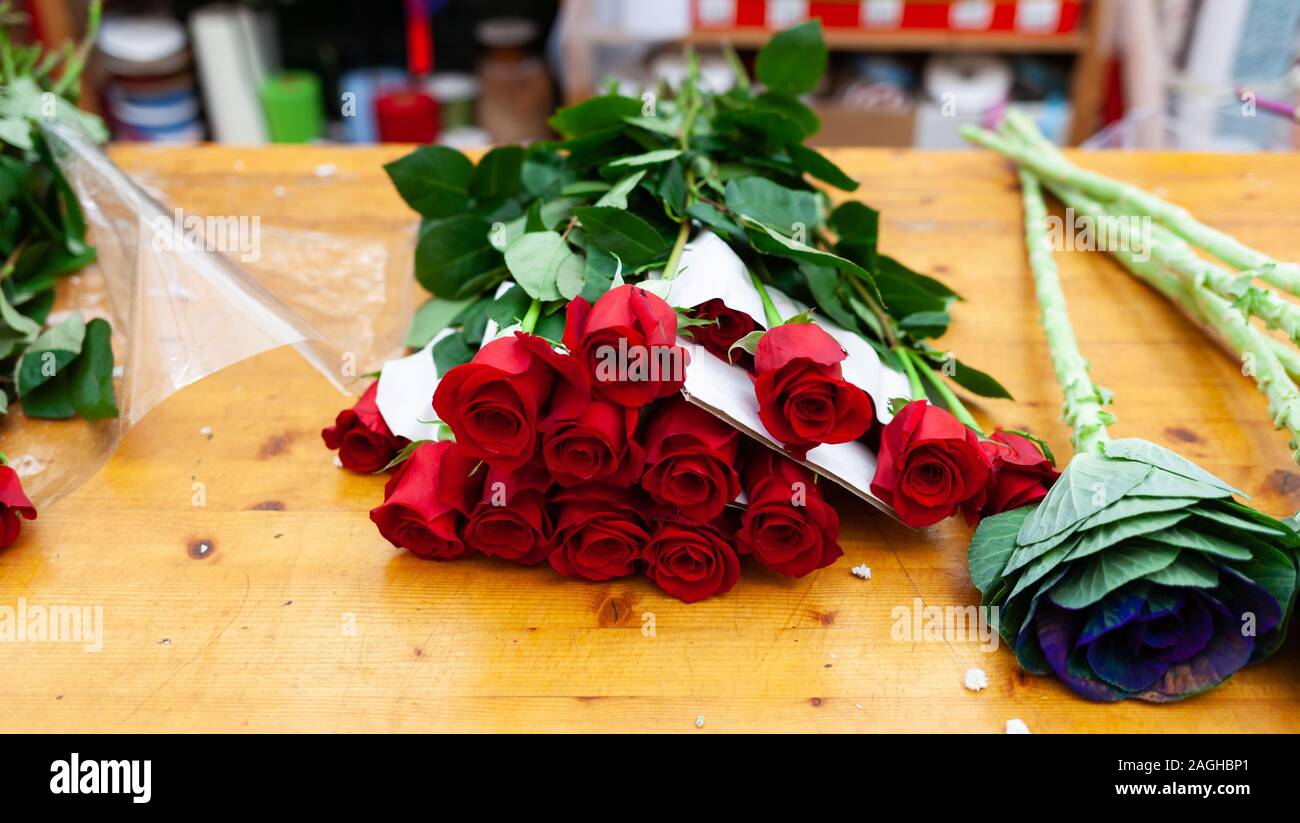 Long-stemmed red roses before being packaged. The flowers are on the ...