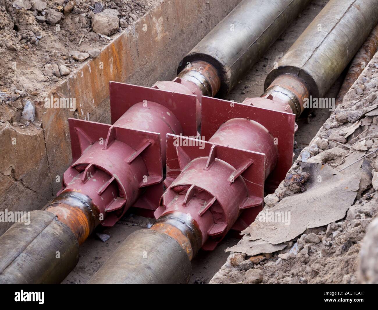 Connection of new heating main pipes through a coupling Stock Photo - Alamy