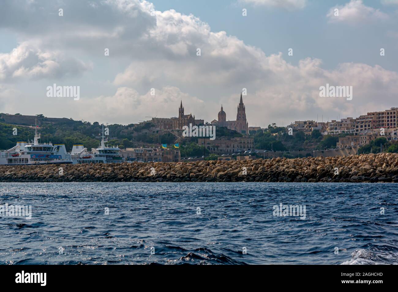 Gozo classic landscape with breakwater and ships in the sea Stock Photo ...