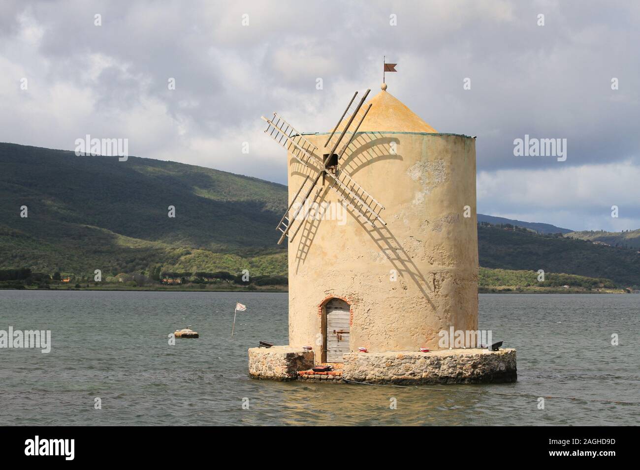Old Spanish windmill in Orbetello lagoon near the Argentario peninsula ...