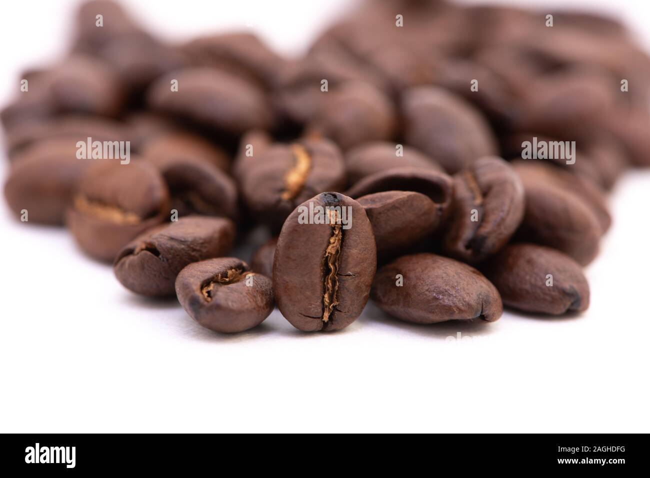 Macro photograph of coffee beans isolated over a white background Stock ...