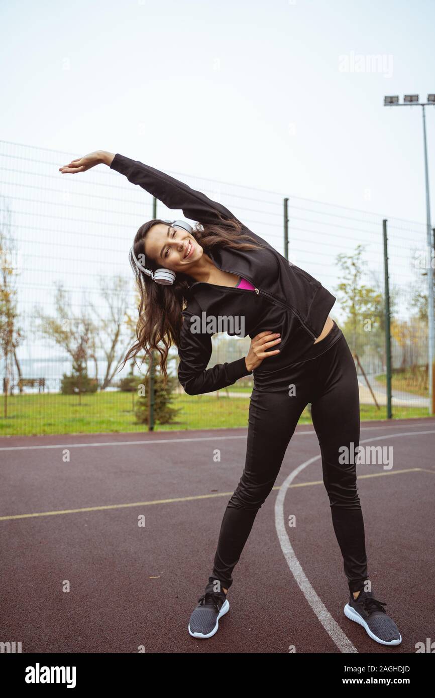 Positive delighted young female person doing sport Stock Photo - Alamy