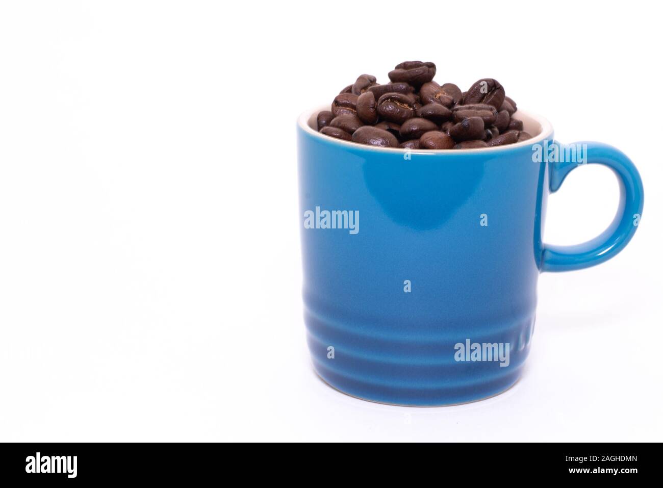 Coffee beans inside a mug isolated over white background Stock Photo ...