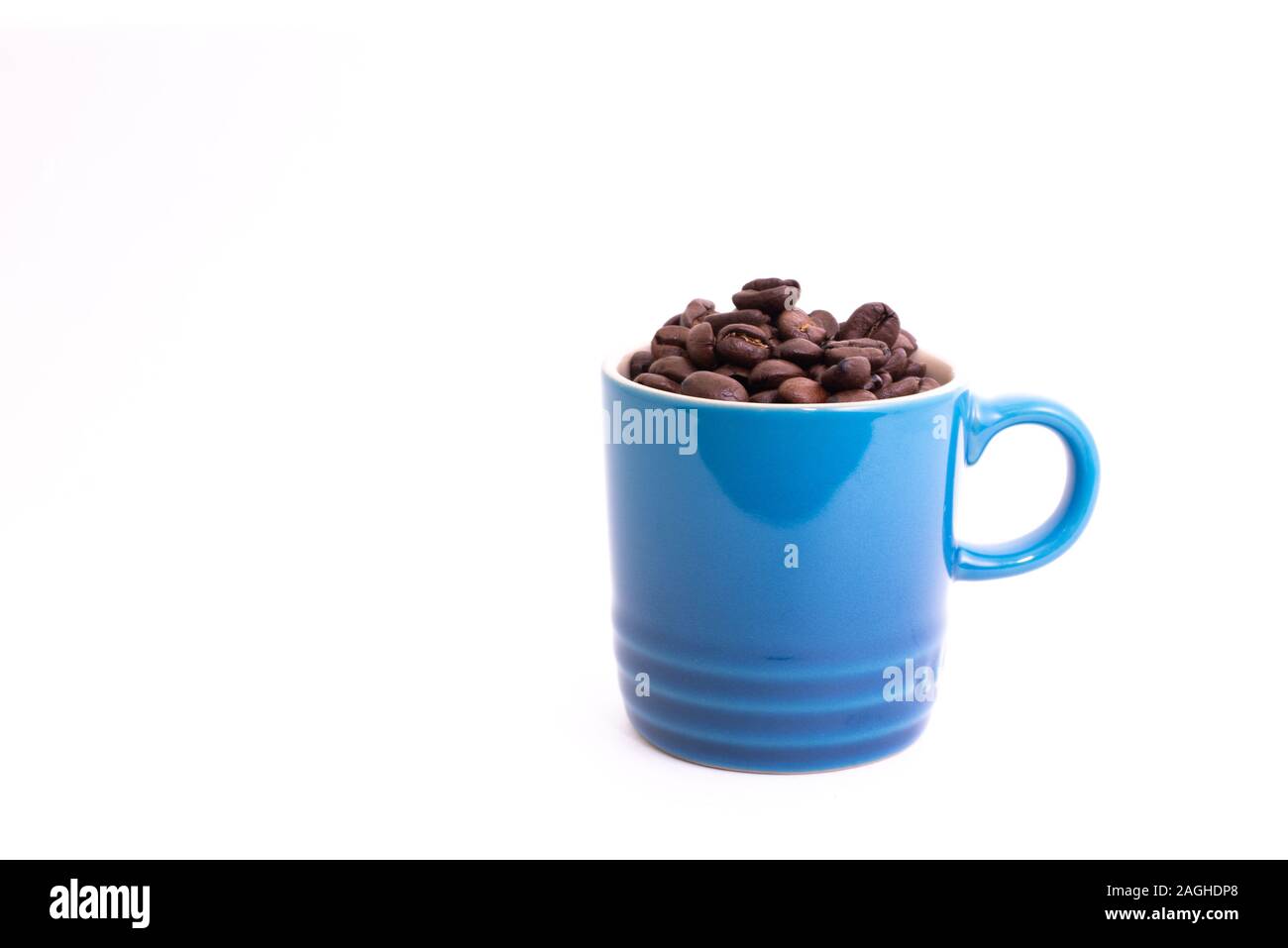 Coffee beans inside a mug isolated over white background Stock Photo ...