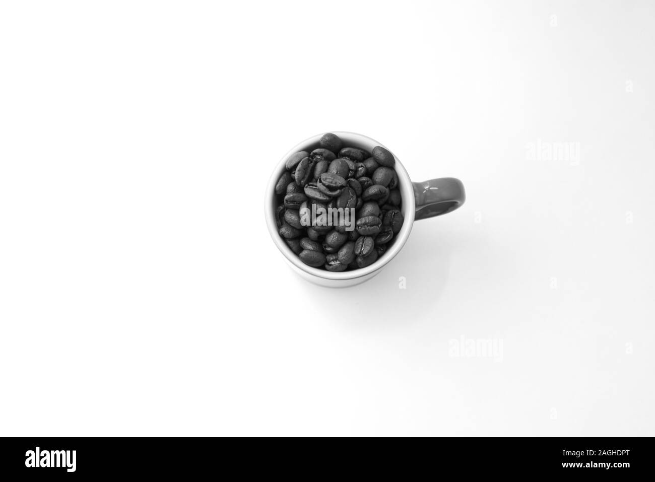 Coffee beans inside a mug isolated over white background Stock Photo ...