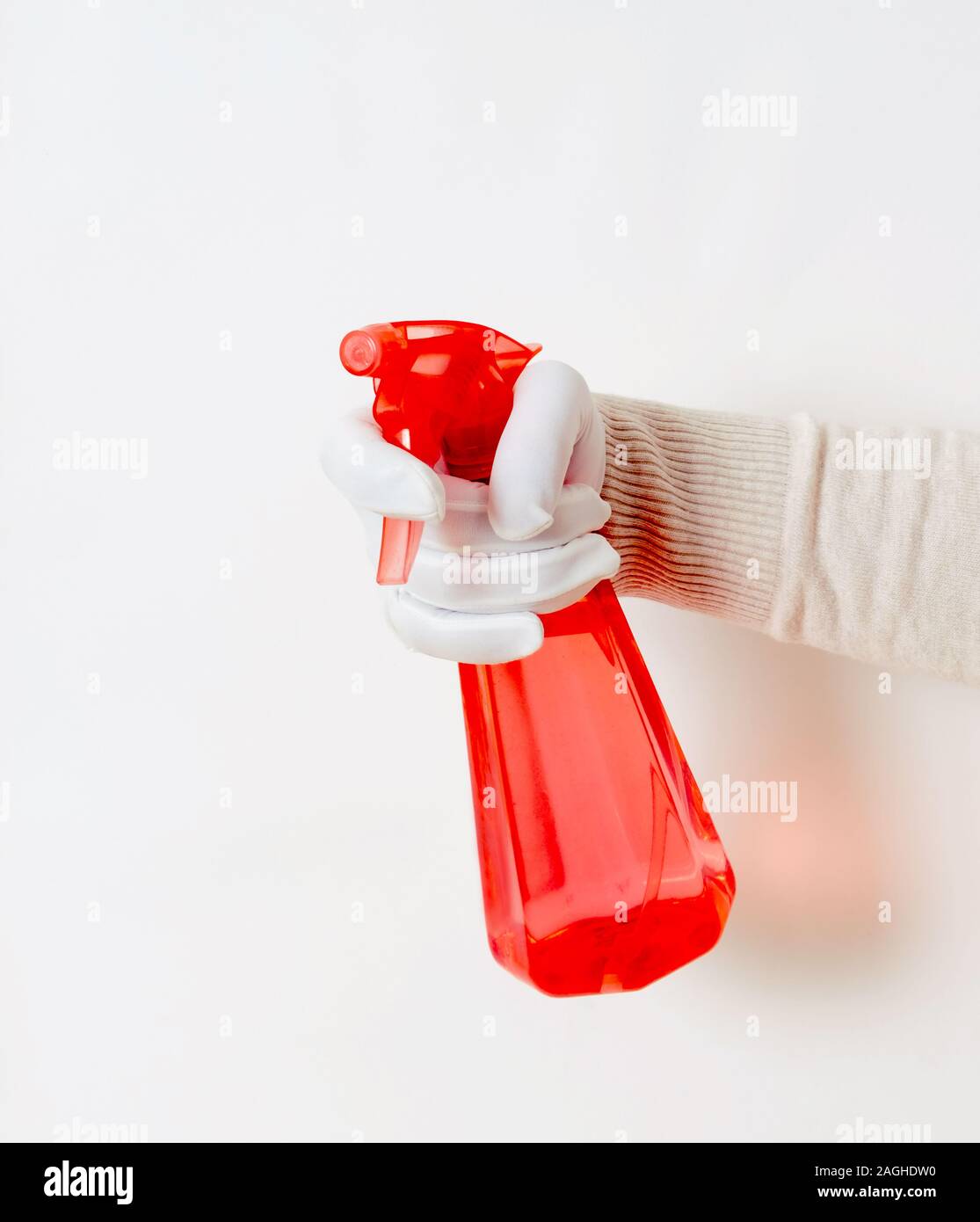 Hand holds red dispenser on the white background. Female hand in white ...