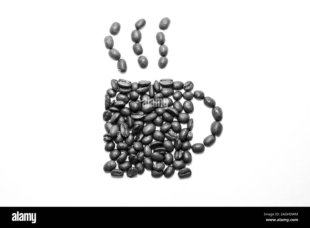 Cup of coffee shape created with coffee beans over a white background ...