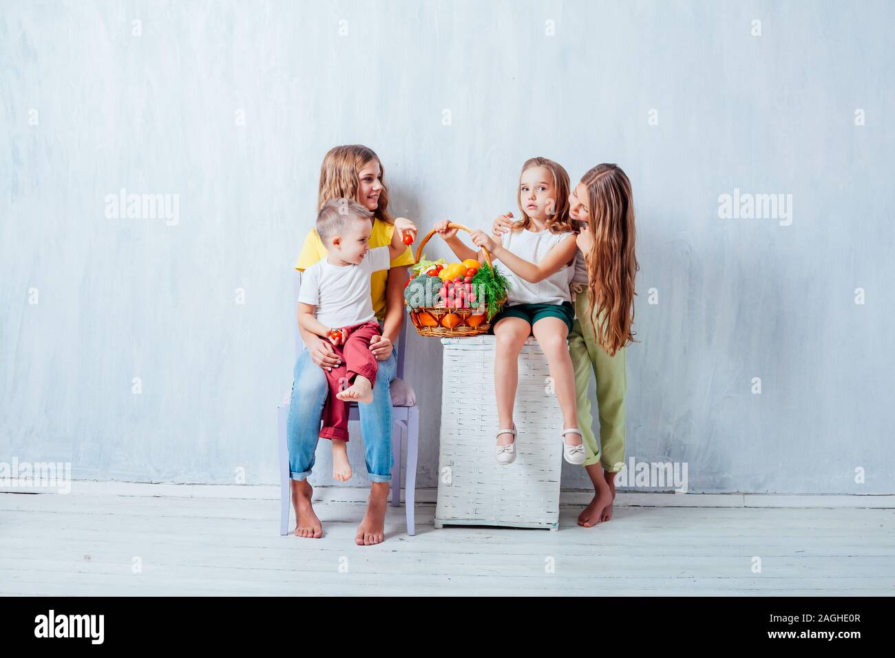 four children with fresh vegetables healthy food Stock Photo - Alamy