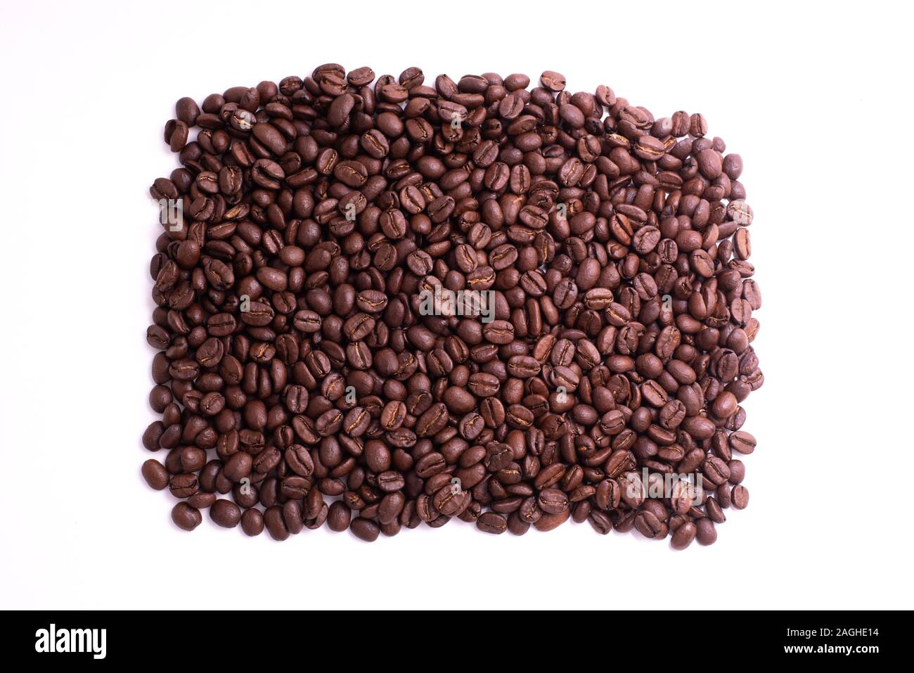 Macro photograph of an square shape formed by coffee beans over a white ...