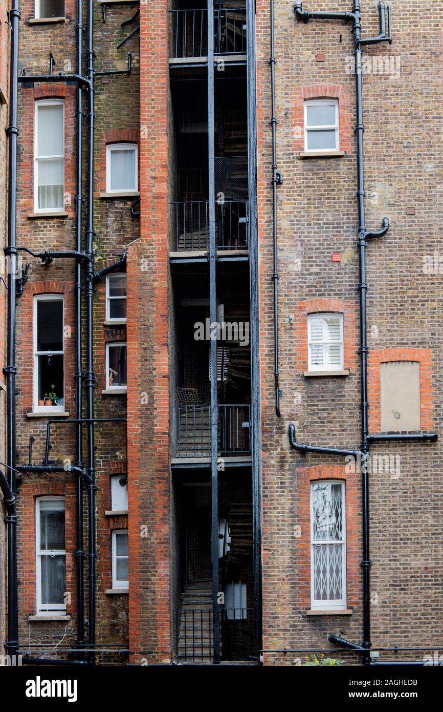 Fire escape behind mansion block in Kensington, London Stock Photo - Alamy