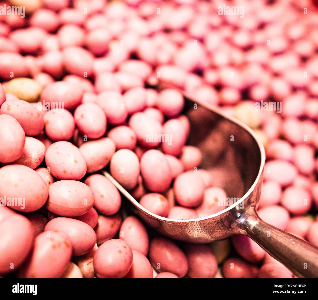 A sweet scoop amongst multi-coloured sweets on sale at a Christmas ...