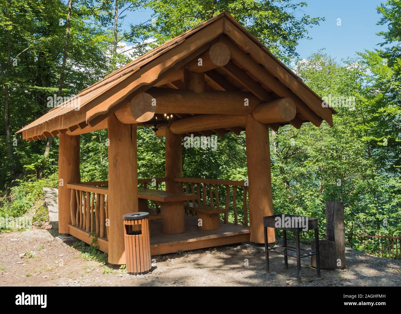 Beautiful summer housefrom a log of a large tree with barbecue for ...