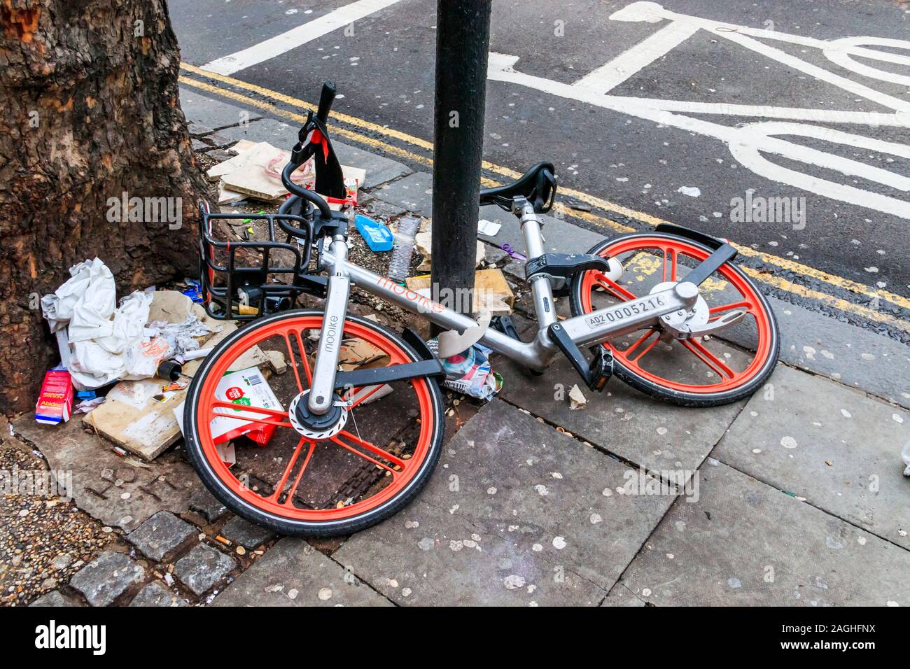 An abandoned Mobike hire bike dumped by the side of Charing Cross Road ...
