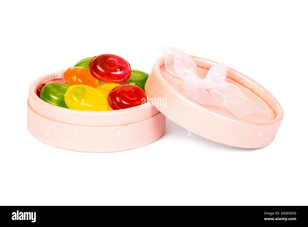 Drop candies in a box Stock Photo - Alamy